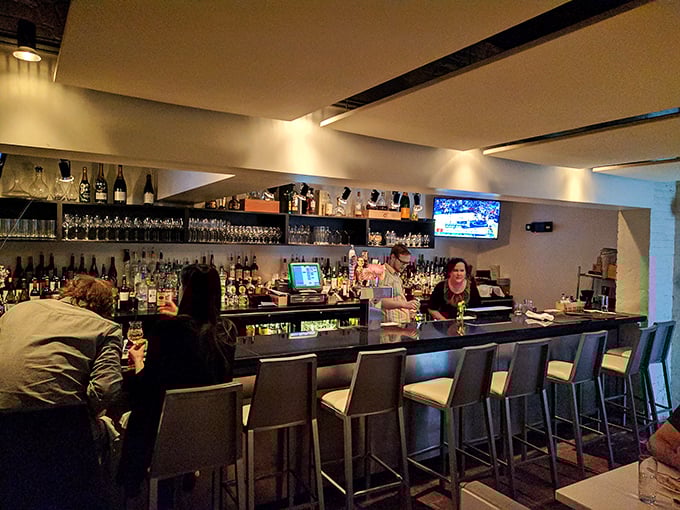 The well-stocked bar invites lingering conversations and spontaneous wine discoveries with knowledgeable staff ready to guide your journey.