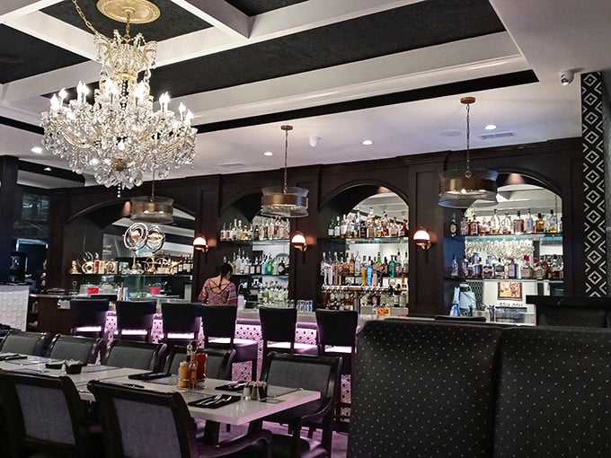 The classic diner counter where conversations flow as smoothly as the freshly brewed coffee.