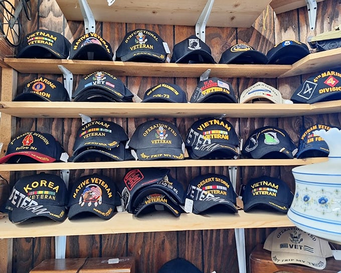 Military history displayed with respect – rows of veteran caps tell stories of service, sacrifice, and the people who wore them.