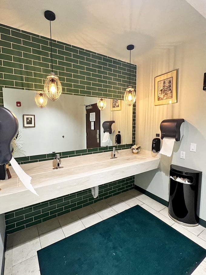 Even the bathroom gets the green tile treatment—proving Magnolia's commitment to quality extends to every corner.