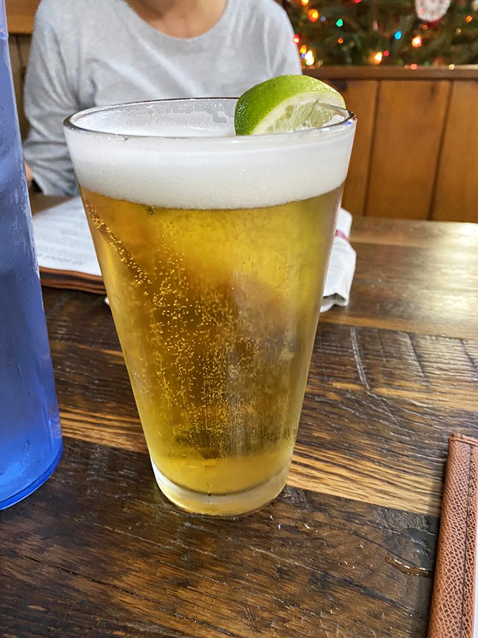Beer so cold and inviting it practically introduces itself. That lime wedge isn't garnish—it's the exclamation point on a perfect barbecue companion.