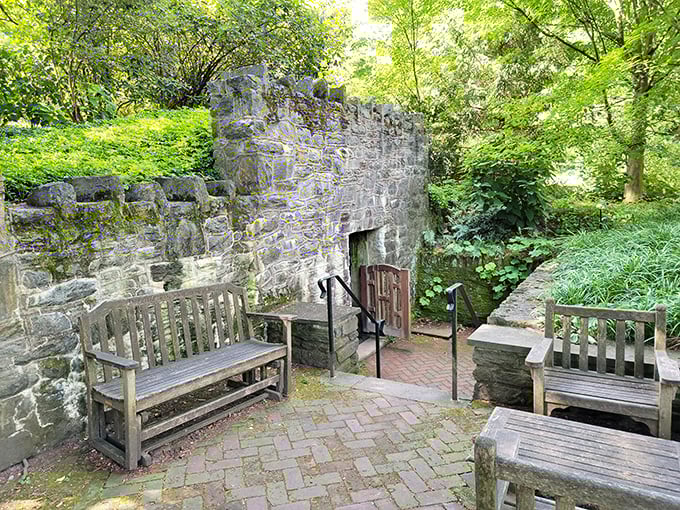 Stone walls and wooden benches create a medieval courtyard vibe. The perfect spot to pretend you're waiting for a messenger from the neighboring kingdom.