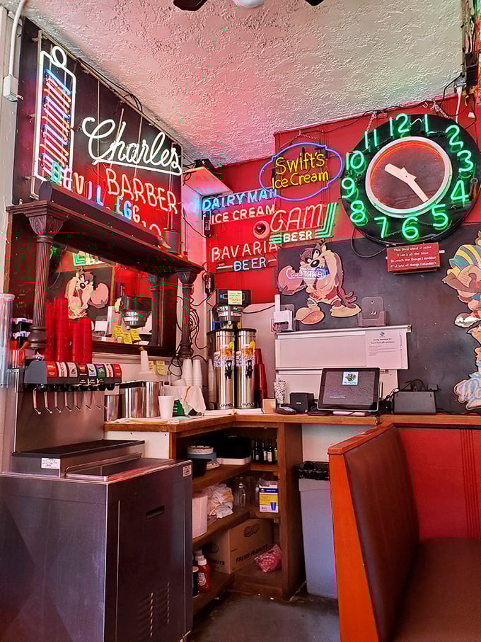 The soda station corner looks like it was decorated by someone who collected every neon sign from every closed ice cream parlor in the Midwest—and we're here for it.