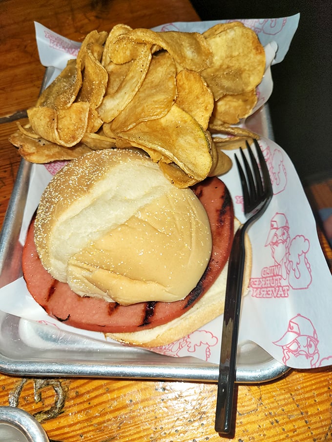 The humble potato chip achieves its highest purpose alongside this sandwich – crispy, salty companions to a simple pleasure done right.