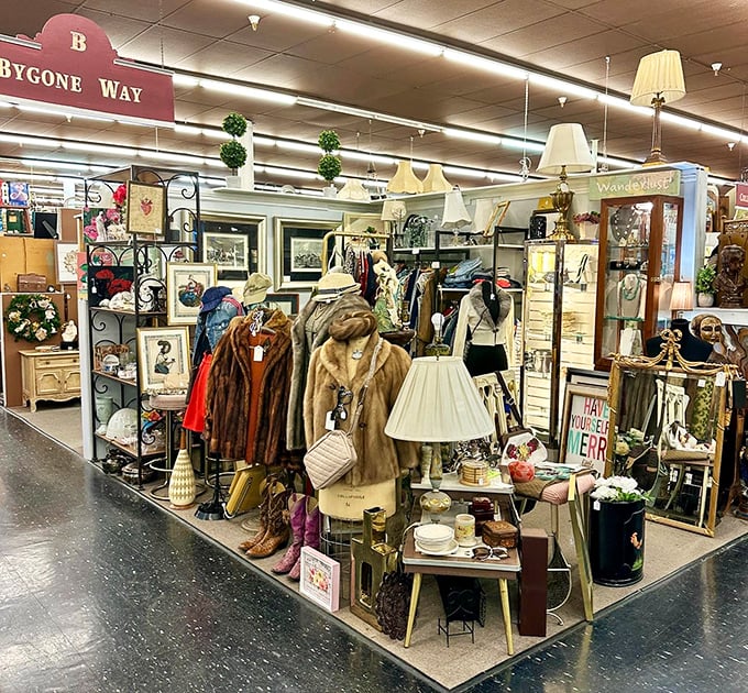 "Bygone Way" booth displays fashion's ghosts—fur coats and vintage dresses waiting for their second act in a world that's constantly recycling style.