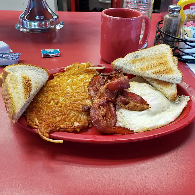 The breakfast platter that answers the eternal question: "Why choose between eggs, hash browns, bacon, and toast when you can have it all?"