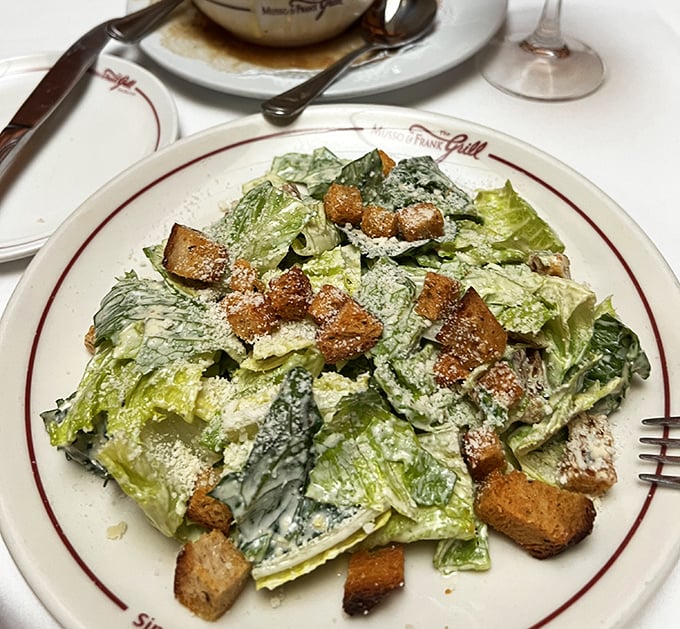 The Caesar salad, a classic performance that never gets old. Crisp romaine takes a bow with perfect croutons and that legendary dressing.