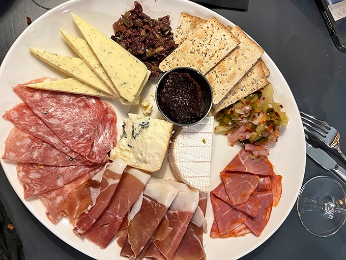 A charcuterie board that tells a story of craftsmanship—where every slice of meat, wedge of cheese, and dollop of jam plays its perfect supporting role.