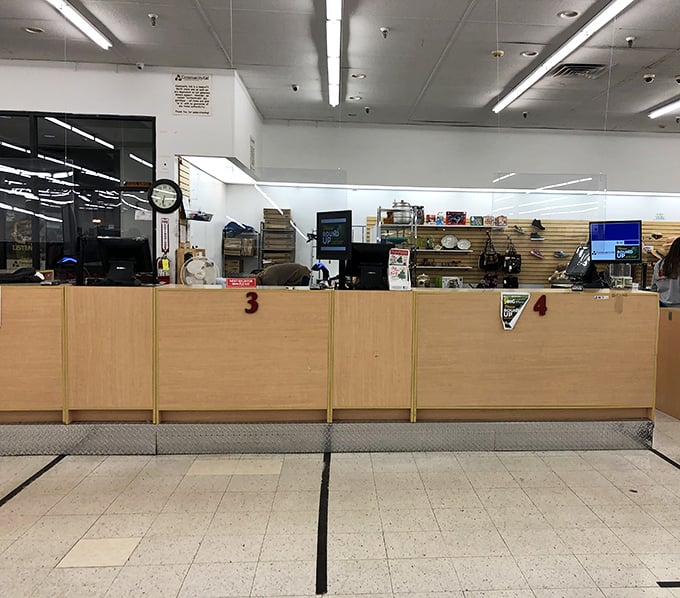 Checkout counters where mathematical miracles occur daily – full carts, empty wallets' worst nightmare nowhere in sight.