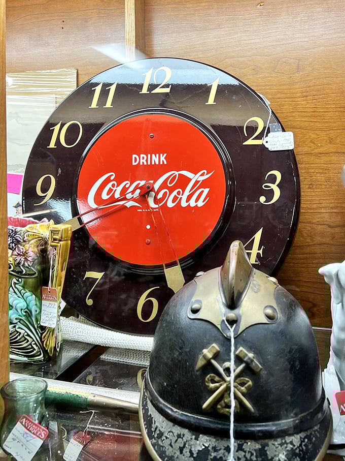 That Coca-Cola clock and vintage firefighter helmet pairing? Pure serendipity that somehow makes perfect sense in the antique universe.