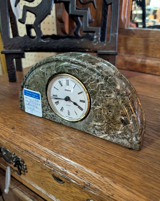 This marble clock doesn't just tell time—it tells stories, having ticked through decades of history on someone's mantel before finding you.