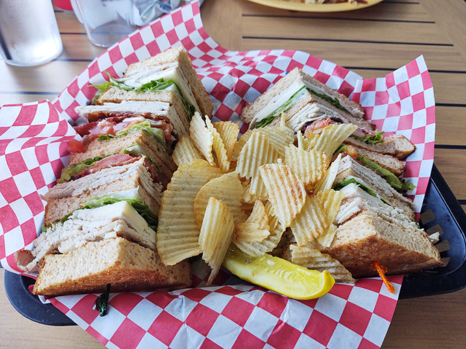 A club sandwich that requires strategic planning to eat. Those layers aren't just stacked—they're architecturally sound and deliciously precarious.