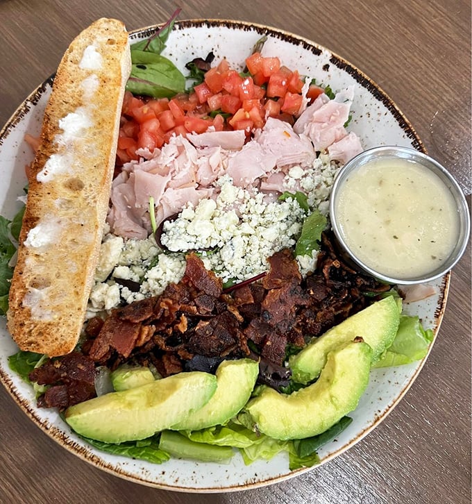 This Cobb salad isn't just lunch – it's a perfectly composed edible color wheel where bacon and avocado play the starring roles.