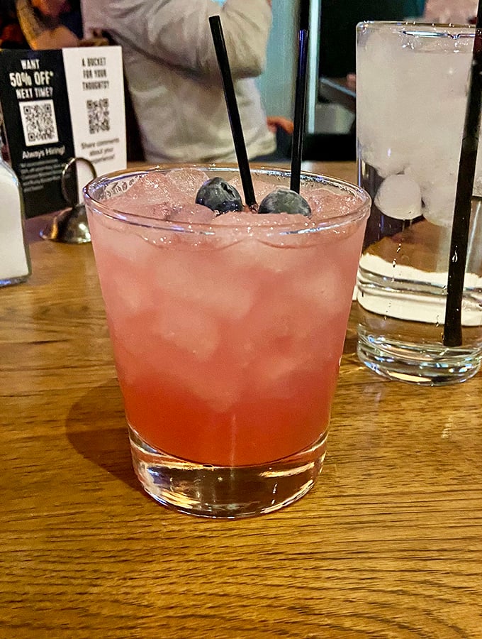 A cocktail that doesn't need umbrellas or flames to impress—just fresh berries, quality spirits, and the promise of good times ahead.