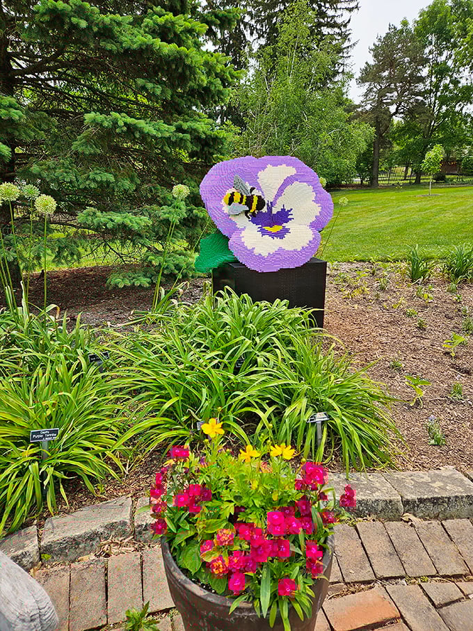 This charming LEGO pansy with visiting bee reminds us that pollinators deserve artistic tribute too—garden education disguised as delightful sculpture.