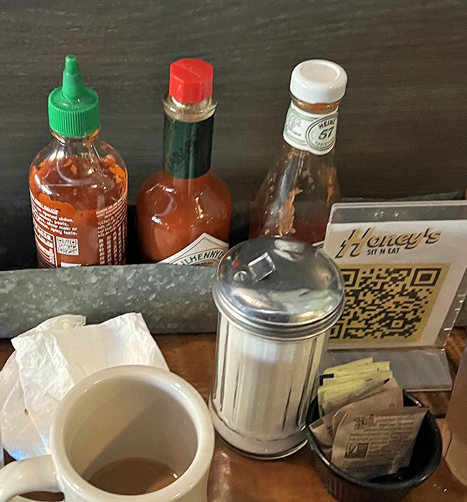 The condiment caddy—where hot sauce dreams and sugar packets live in perfect harmony, ready to customize your breakfast experience.
