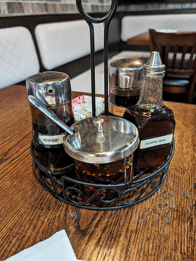 The condiment caddy—your personal flavor command center. That dumpling sauce is liquid gold that would make Fort Knox jealous.
