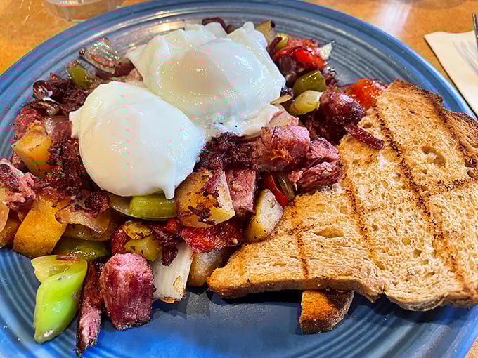 Corned beef hash crowned with two perfectly poached eggs—a breakfast so beautiful it deserves its own Instagram account and fan club.