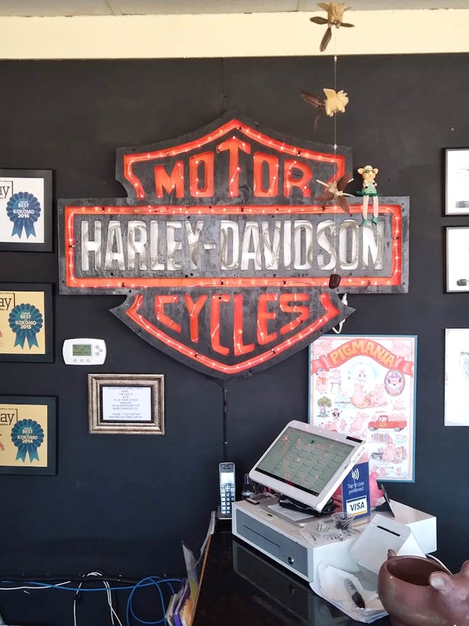 The ordering counter, where barbecue dreams begin their journey from smoker to stomach under the watchful gaze of that iconic Harley logo.