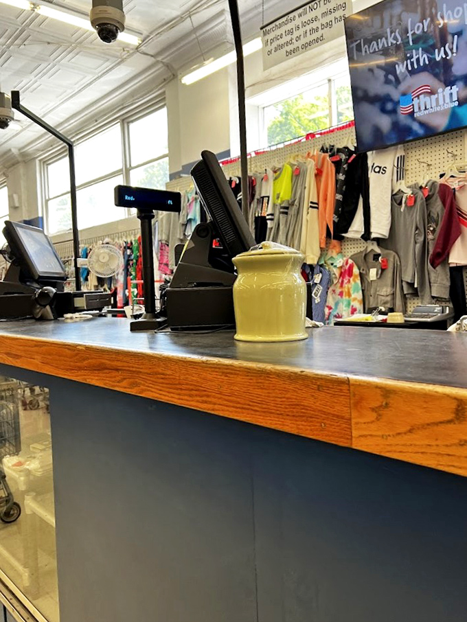 Where treasures change hands and bargains become official. This humble checkout counter has witnessed countless "You'll never believe what I found!" moments.