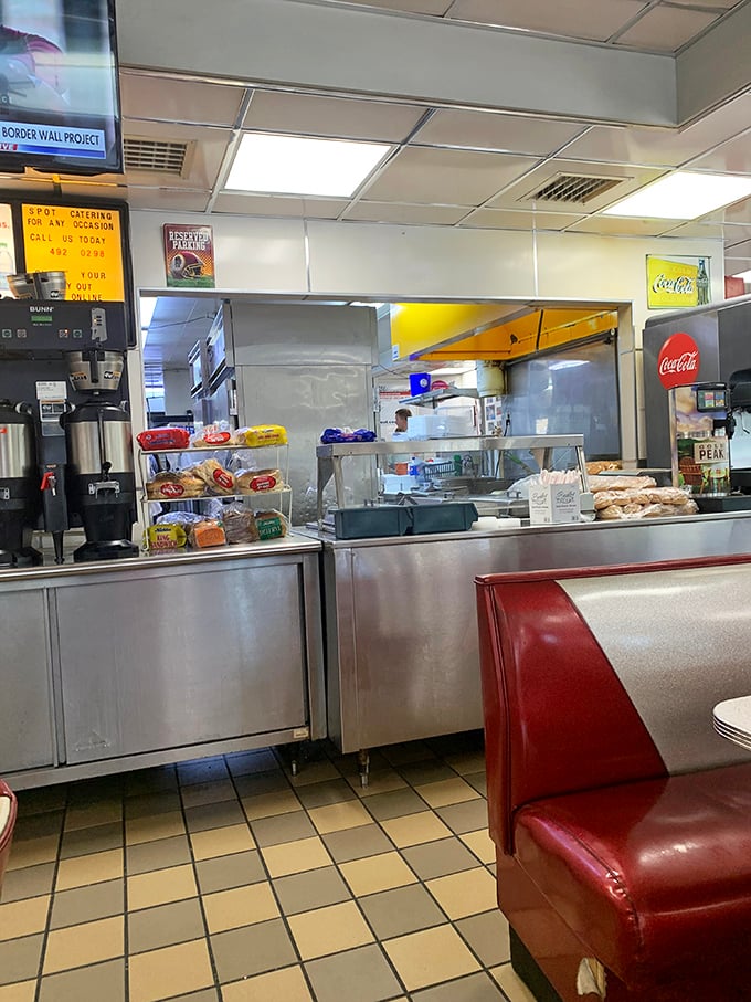 The kitchen pass—that magical portal where orders go in and comfort food emerges, overseen by cooks who've probably been making the same perfect dishes for decades.