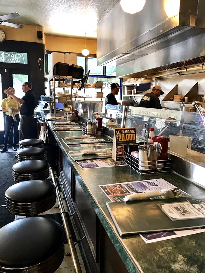 The counter seats offer front-row tickets to the culinary show, where breakfast dreams are assembled with short-order precision.