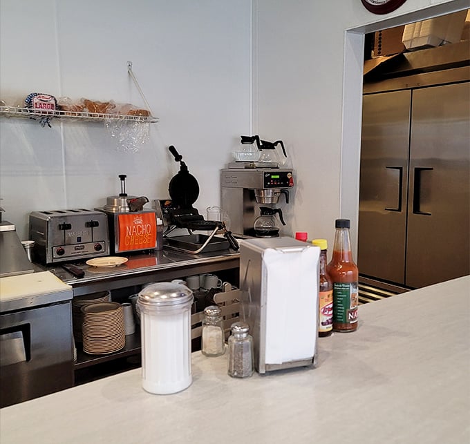 The beating heart of breakfast operations – where coffee percolates with purpose and napkin dispensers stand ready for the inevitable delicious mess.