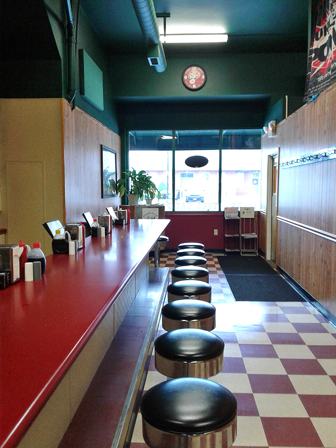 The counter seating—where solo diners become temporary neighbors and the rhythm of short-order cooking becomes the soundtrack to your meal.