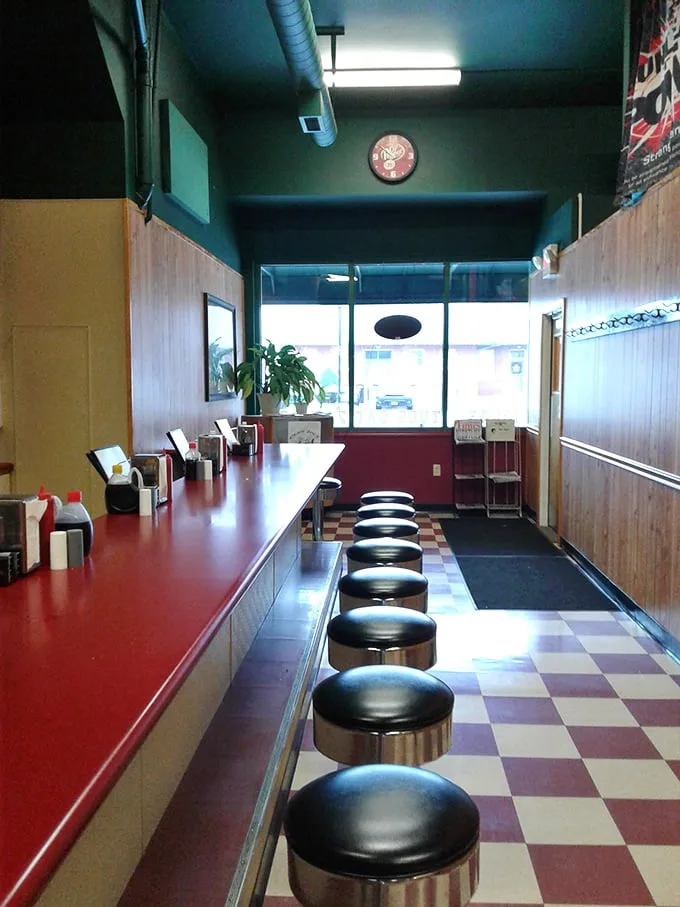The counter seating—where solo diners become temporary neighbors and the rhythm of short-order cooking becomes the soundtrack to your meal.