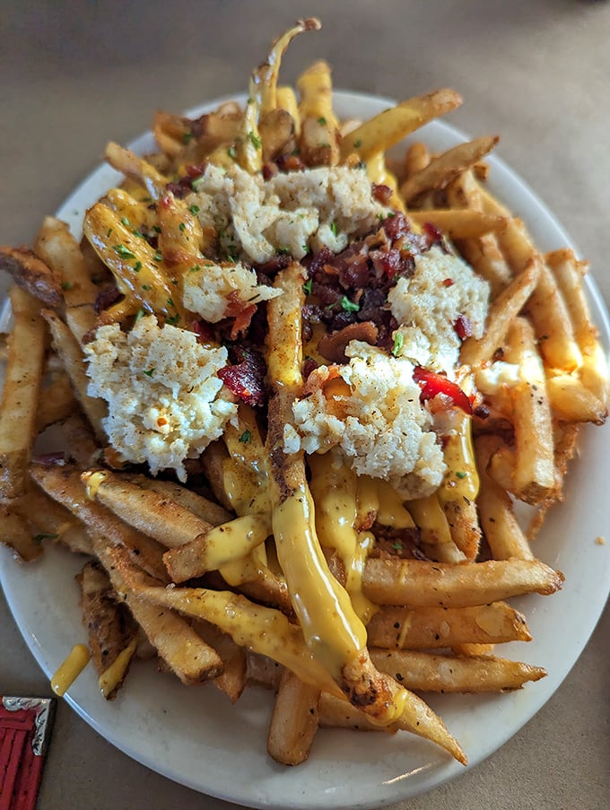 Crab-topped fries drizzled with cheese sauce—where potato meets ocean in a romance that would make Neptune himself blush with delight.