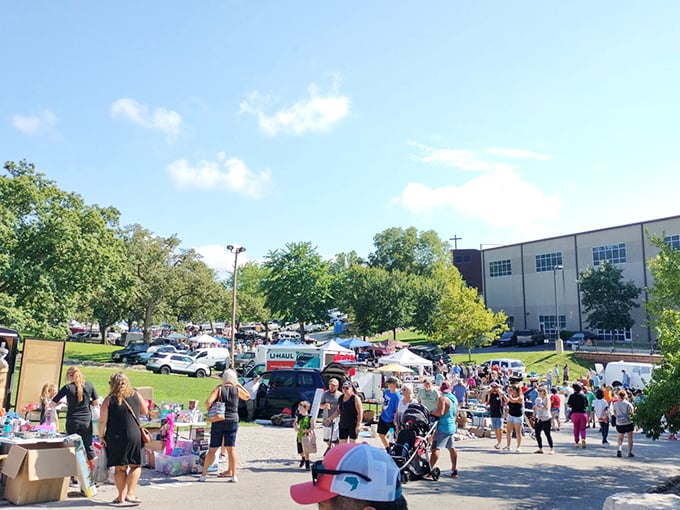 The great American pastime—flea market shopping! Families and treasure hunters converge under perfect blue skies for a day of discovery.