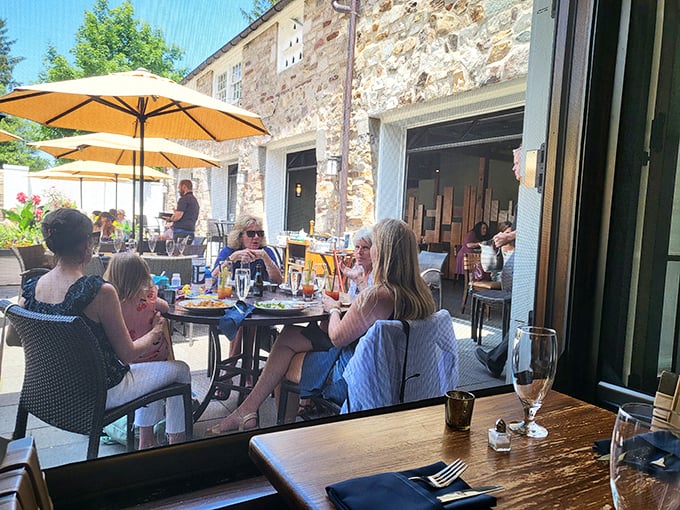 Conversations flow as freely as the wine on this sun-dappled patio—the true ingredient in memorable dining experiences.