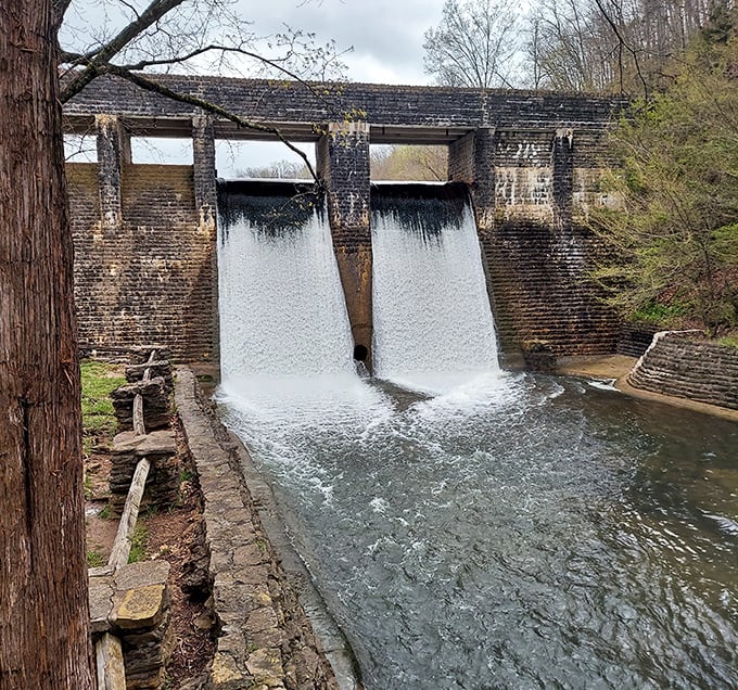 This historic dam transforms falling water into visual poetry, a reminder that sometimes the most impressive engineering works with nature, not against it.