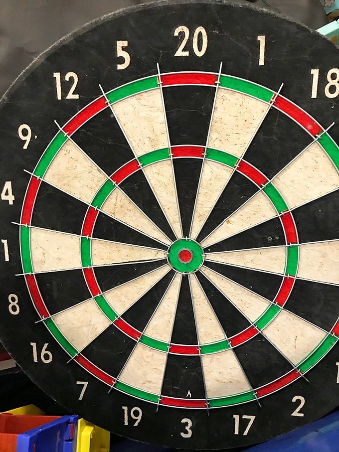 Bull's-eye! A vintage dartboard that's seen countless near-misses and celebratory cheers. Just imagine the game nights this has witnessed.