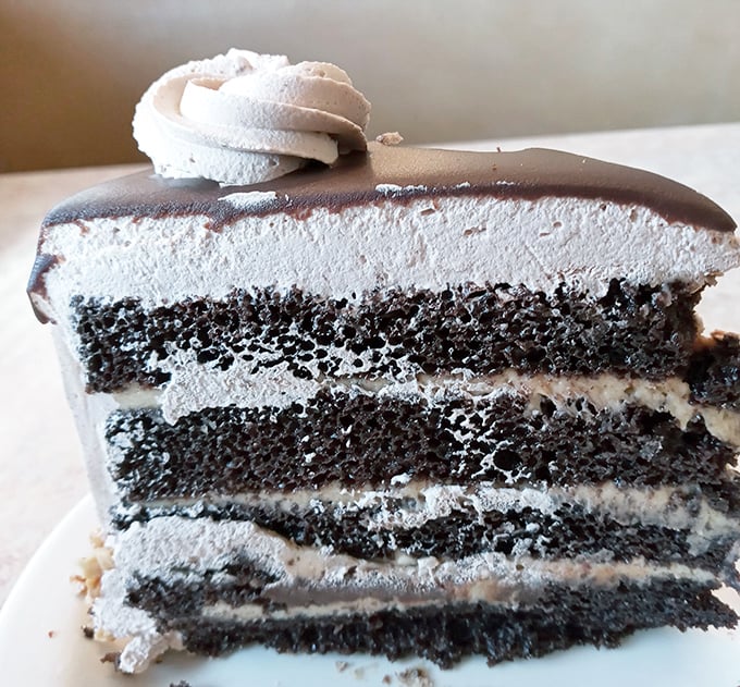 Layer upon layer of chocolate cake and cream—architectural evidence that someone in the kitchen understands the meaning of joy.