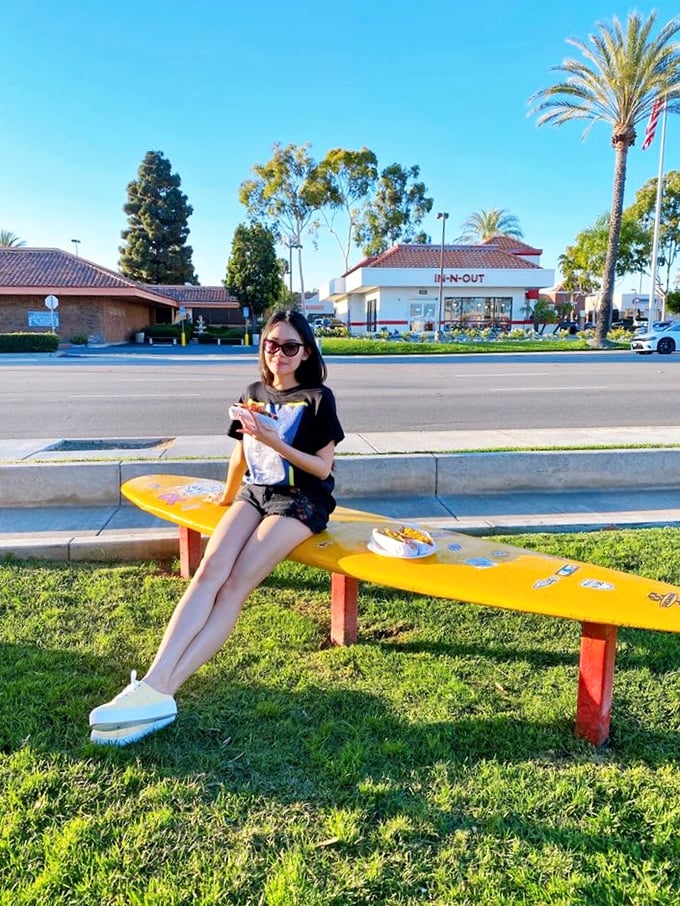 Outdoor dining with a side of people-watching—the bench is just a bonus feature of the PCH experience.