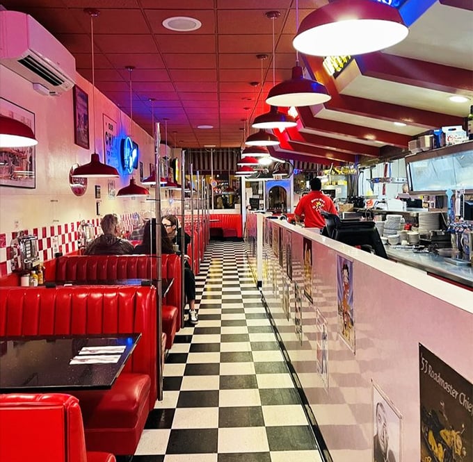 The diner's perspective stretches out like a Norman Rockwell painting come to life, where conversations buzz as steadily as the neon signs.
