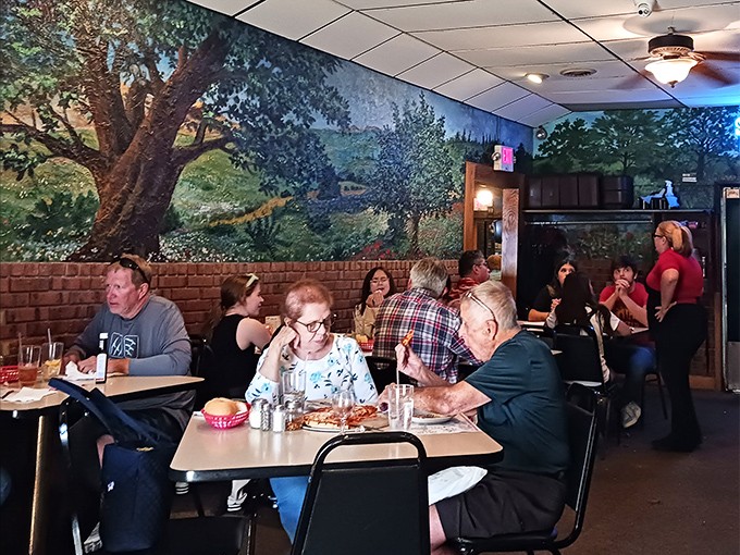 The dining room hums with the beautiful symphony of conversation and clinking silverware—the soundtrack of community that's as essential as the food itself.
