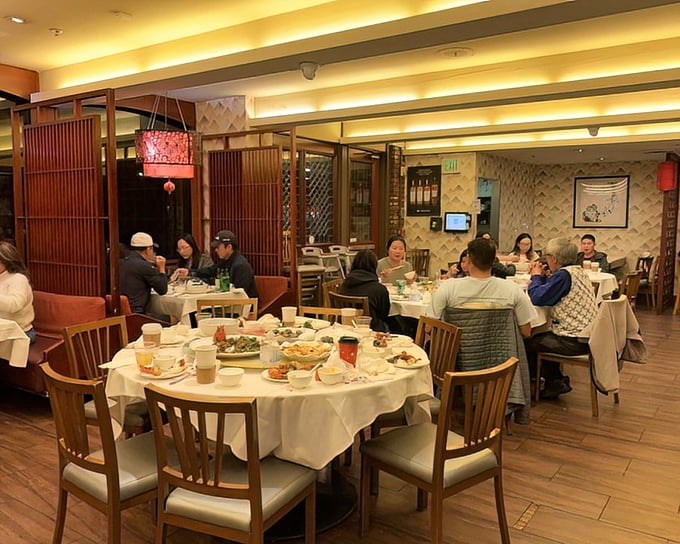 Round tables foster the sharing spirit that defines the Newport experience—where passing plates becomes a delicious choreography.