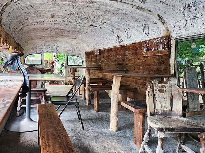 The school bus dining area—where eating hot dogs becomes an immersive experience. Those signatures on the ceiling? Each tells a story.