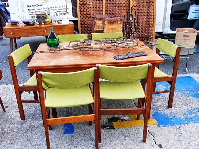 Danish modern dining perfection with avocado-green upholstery that screams "Mad Men dinner party"—just add martinis and conversations about the space race.