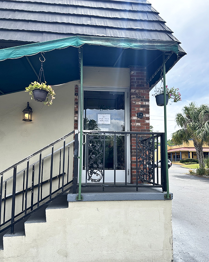 The entrance to Wolfy's—complete with hanging plants and a green awning—like the gateway to a more delicious dimension of breakfast.