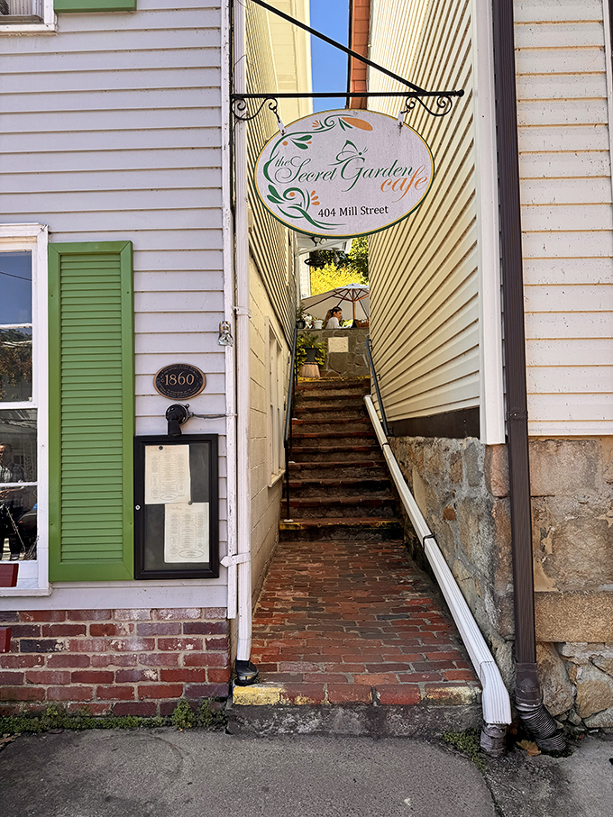 The entrance reveals itself like the namesake "secret garden"—a hidden stairway promising culinary adventures just steps away.