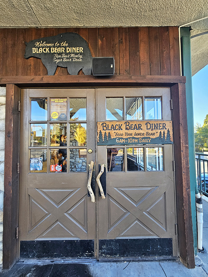Welcome to Black Bear Diner—wooden doors with antler handles invite you to "Feed Your Inner Bear" in true mountain style.