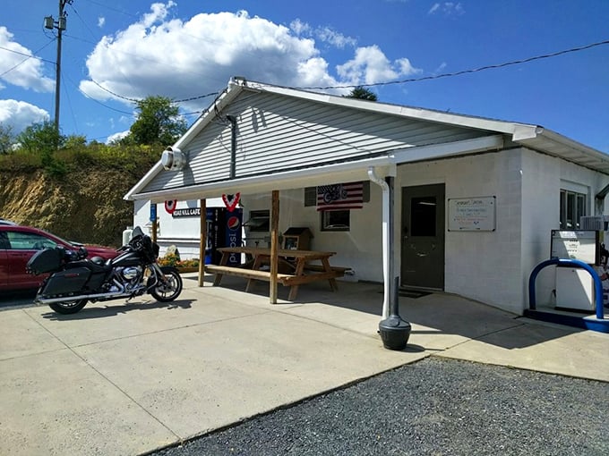 The welcoming entrance with picnic table says "come as you are." No dress code required at this unpretentious roadside haven—just bring your appetite.