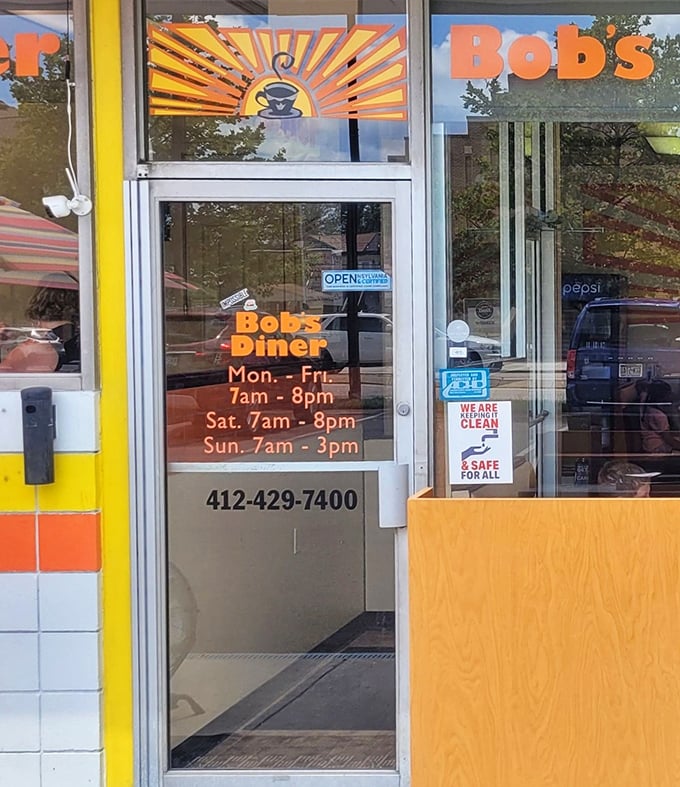 Business hours posted clearly – because knowing when you can get your next fix of diner goodness is essential information.