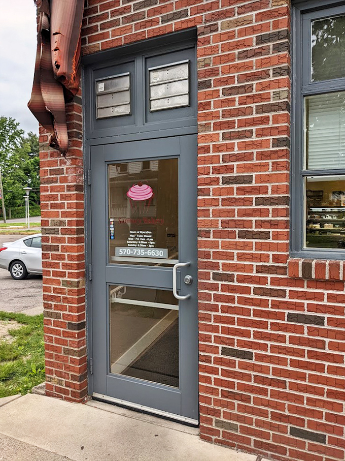 The entrance to happiness is a simple brick doorway with a cupcake decal. No red carpet needed when what awaits inside is this good.