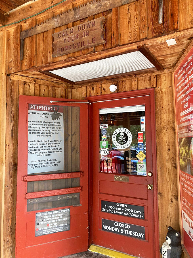 Calm Down You're In Forksville – sage advice above a red door that promises culinary salvation to those who've made the pilgrimage.