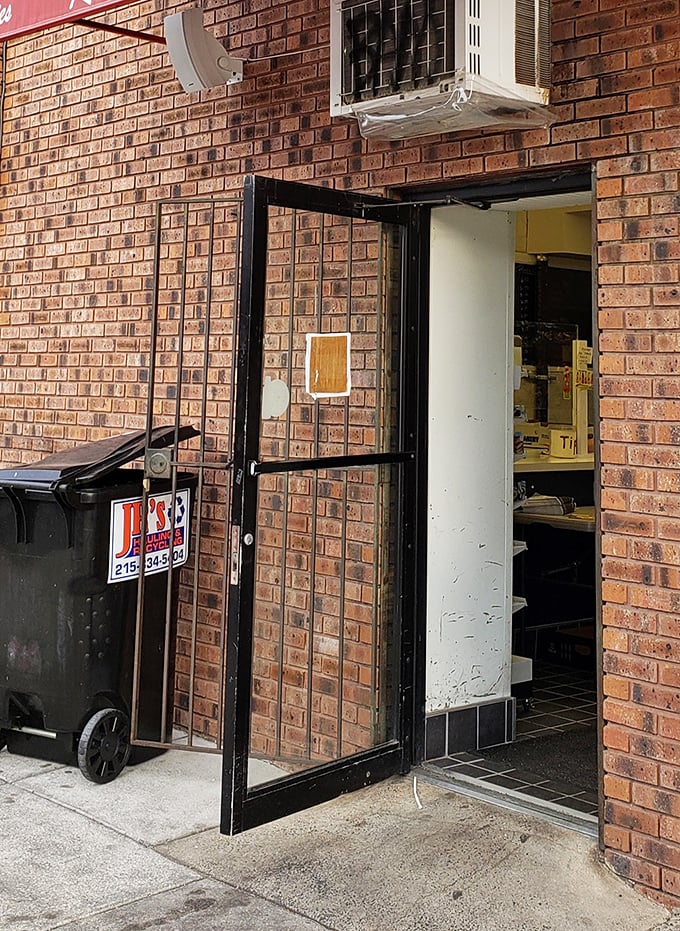The unassuming entrance belies the culinary treasures within—like finding the door to Narnia, but with better sandwiches.