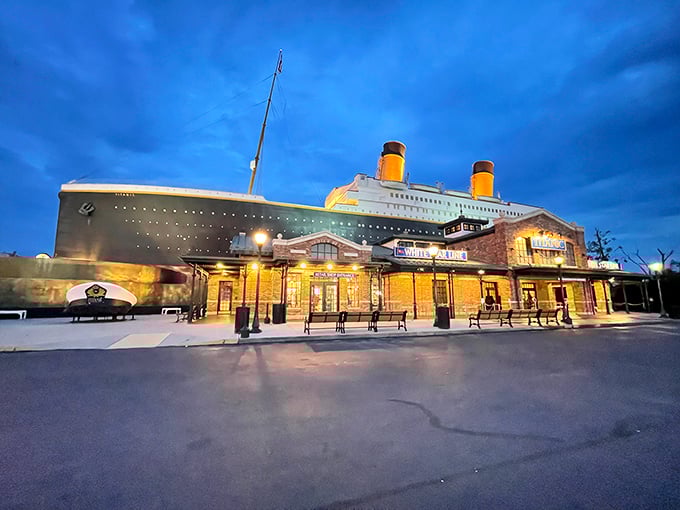 As twilight falls, the Titanic Museum takes on an ethereal quality, its illuminated form standing against the darkening Tennessee sky.
